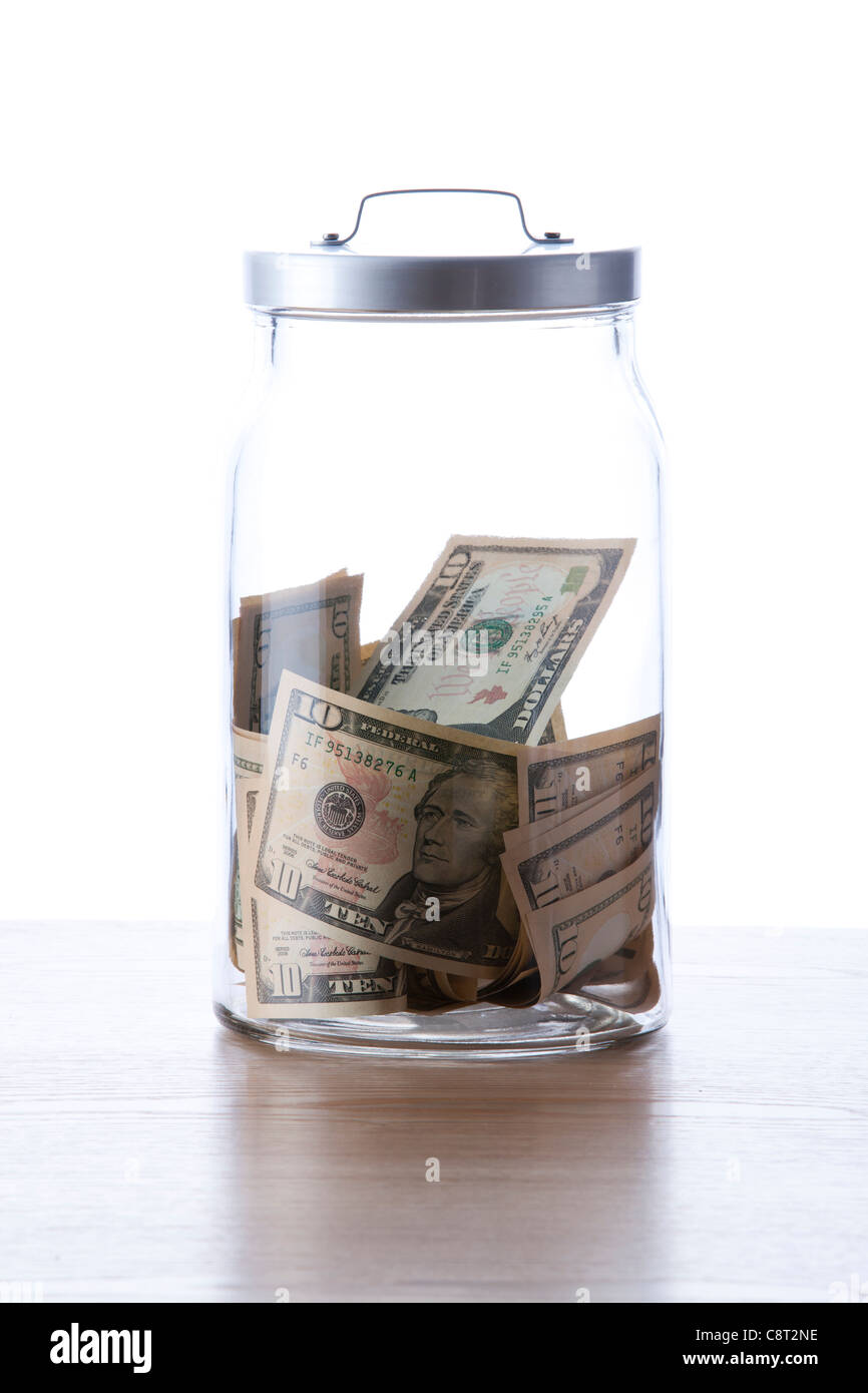 Glass jar filled with American dollar bills Stock Photo - Alamy
