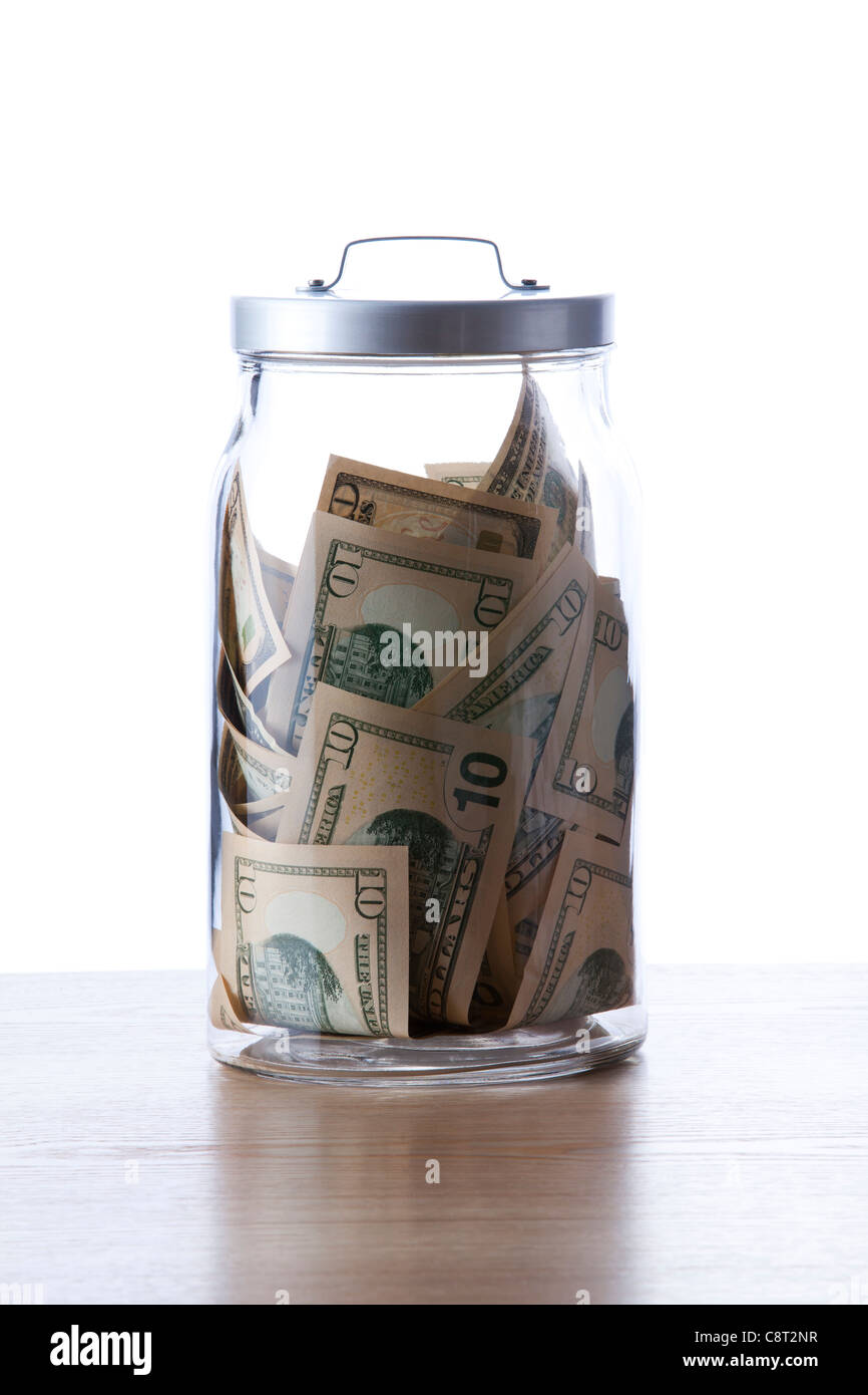 Currency Inside The Glass Jar Stock Photo - Alamy
