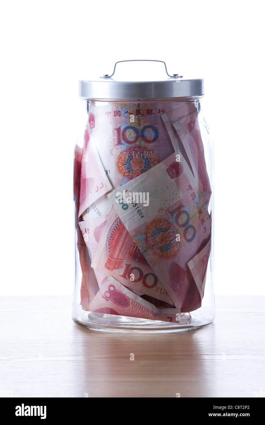 Currency Inside The Glass Jar Stock Photo - Alamy