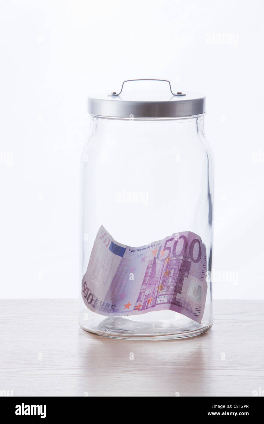 Currency Inside The Glass Jar Stock Photo - Alamy