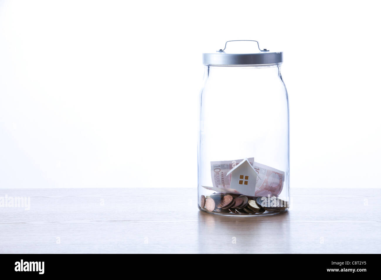 Currency Inside Glass Jar Stock Photo - Alamy