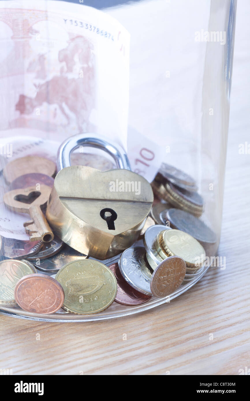 Money and lock hi-res stock photography and images - Alamy