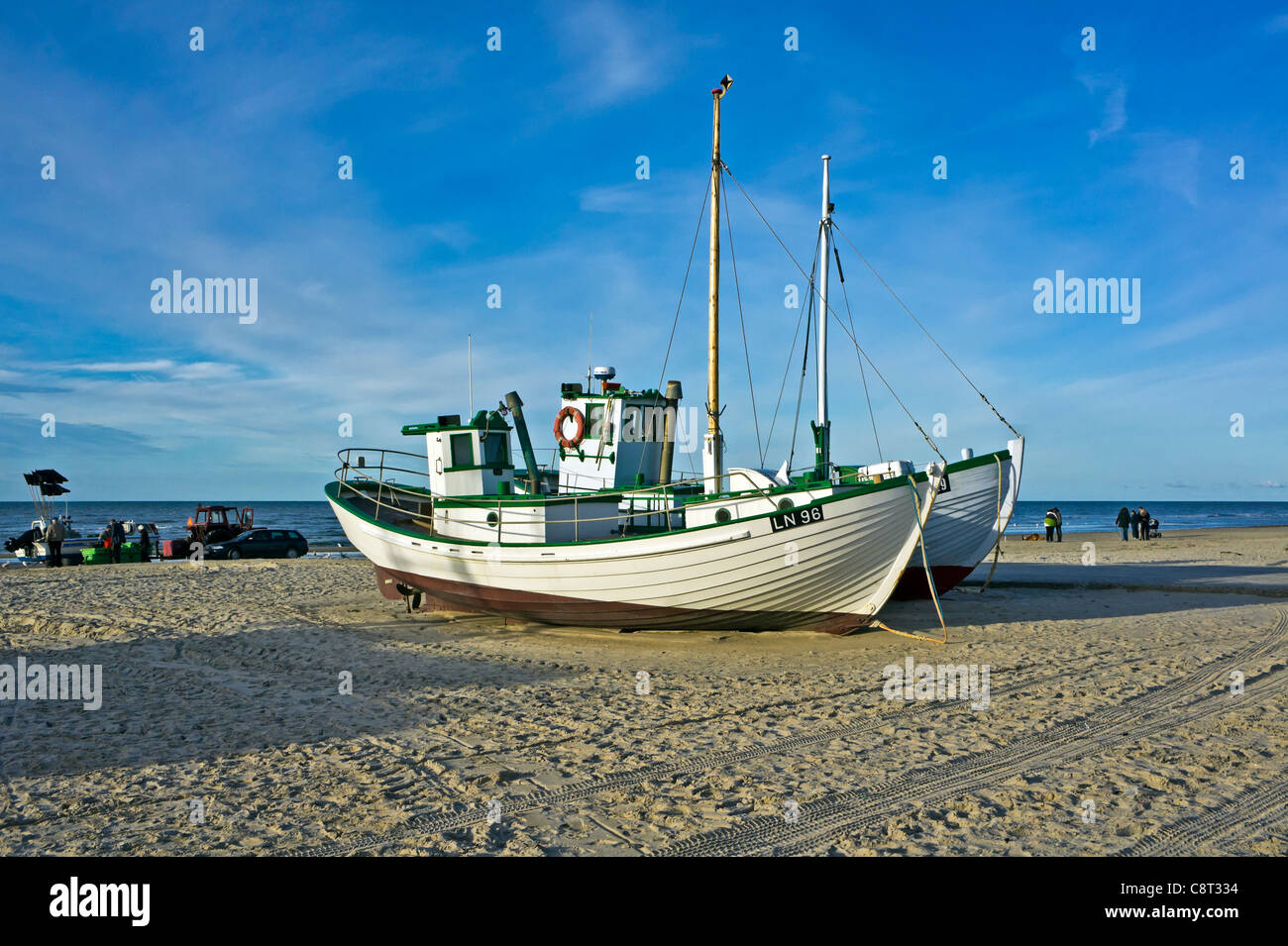 A lineup of two small Danish Fishing boats beached at Lokken in ...