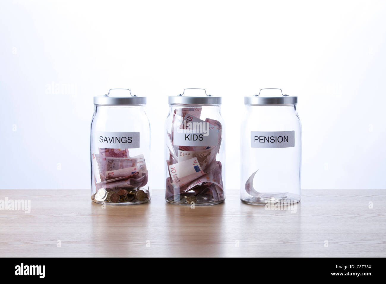 Currency Inside Three Jar Stock Photo - Alamy