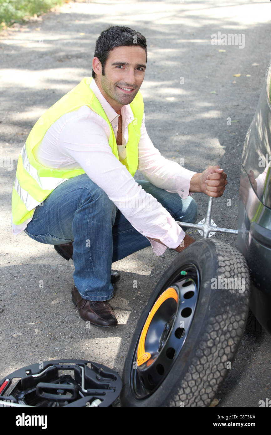 Changing the wheel on a car Stock Photo - Alamy