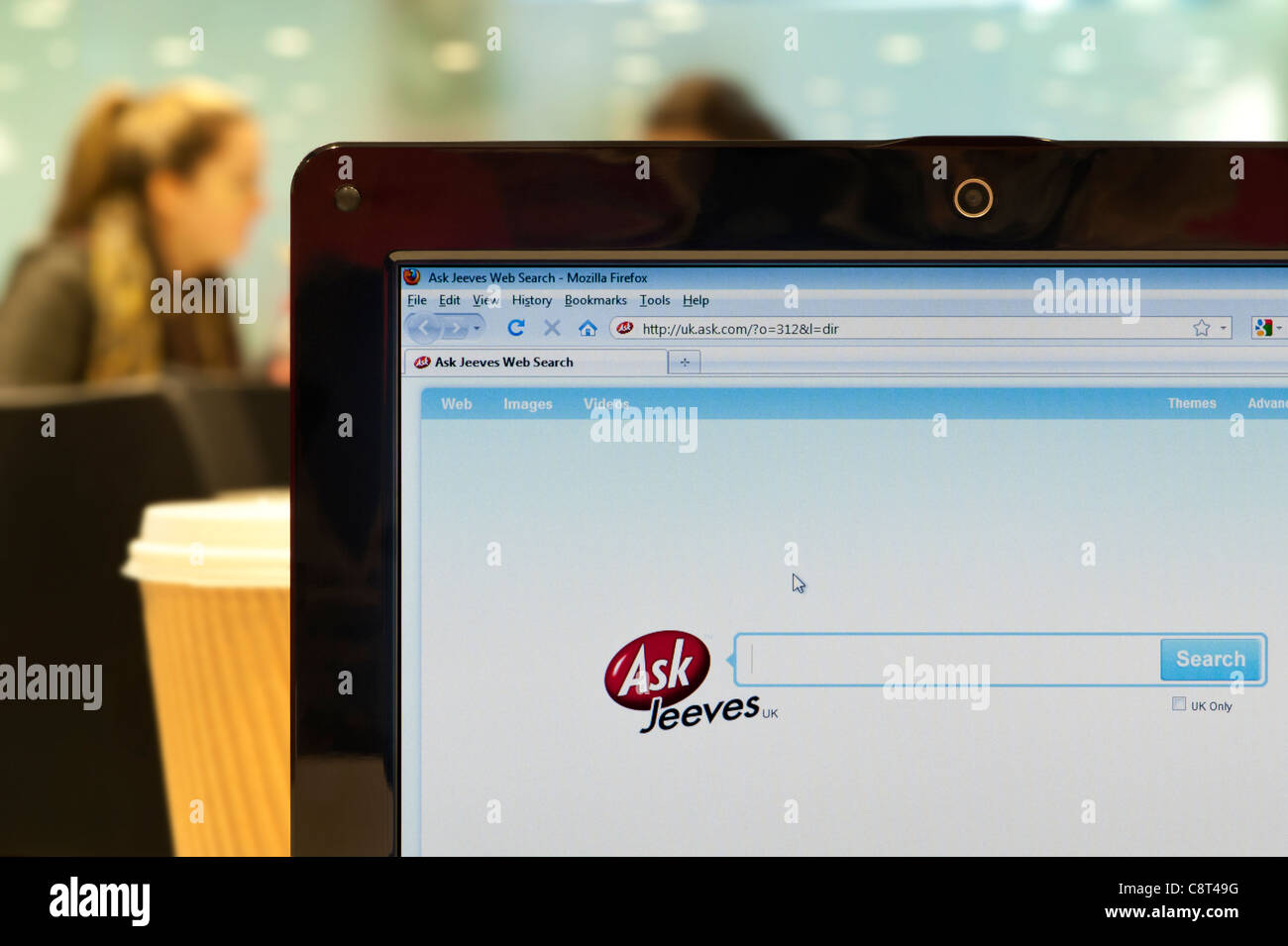 The Ask Jeeves website shot in a coffee shop environment (Editorial use ...
