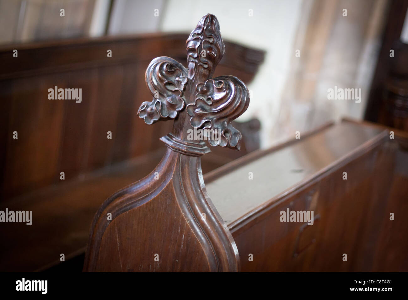 The end of a pew in a Church Stock Photo - Alamy