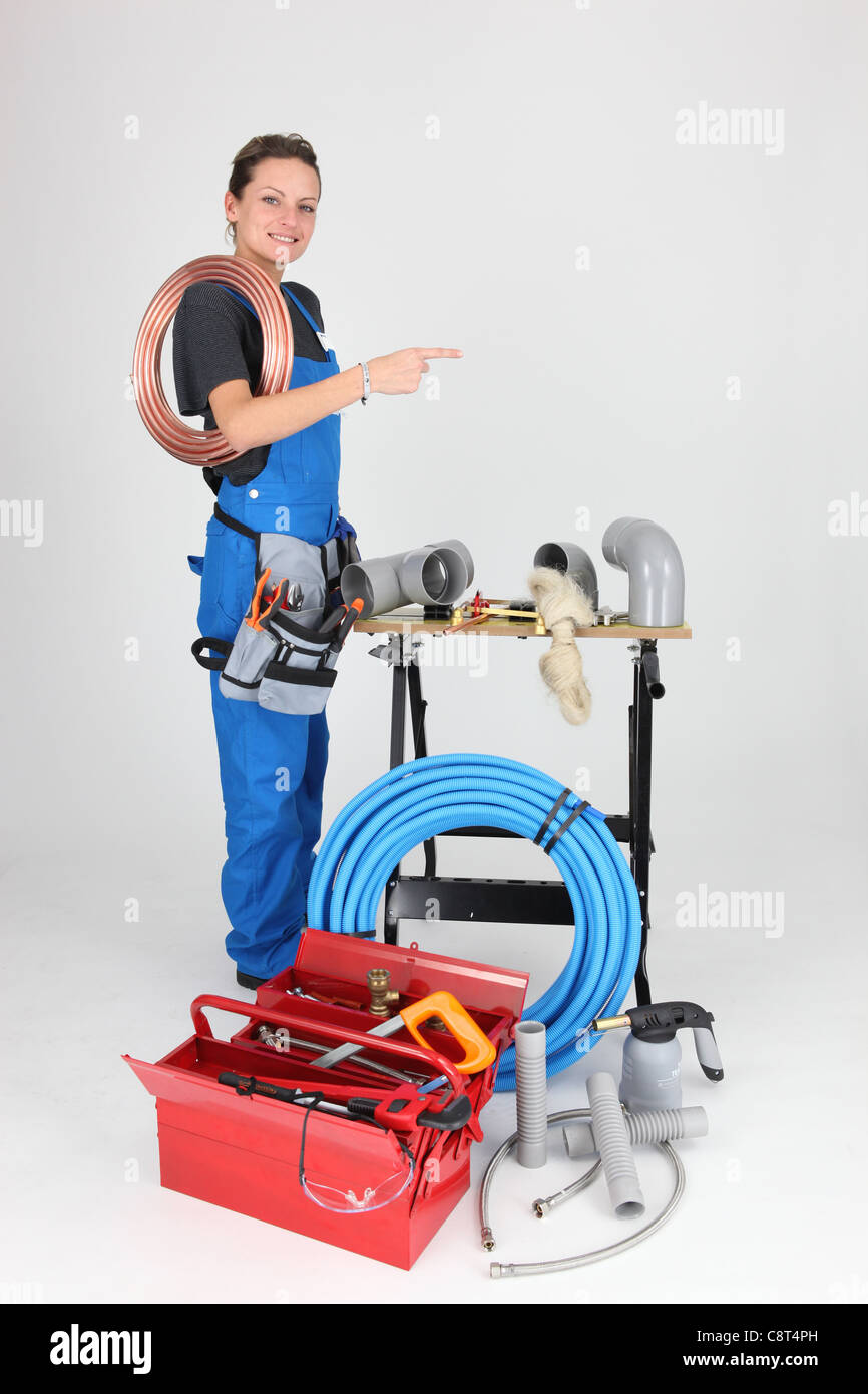 Female plumber pointing Stock Photo - Alamy
