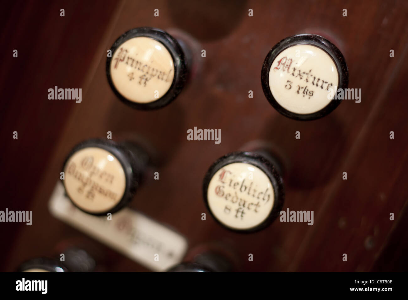 A pipe organs keyboard which is a religious instrument used in a Church ...