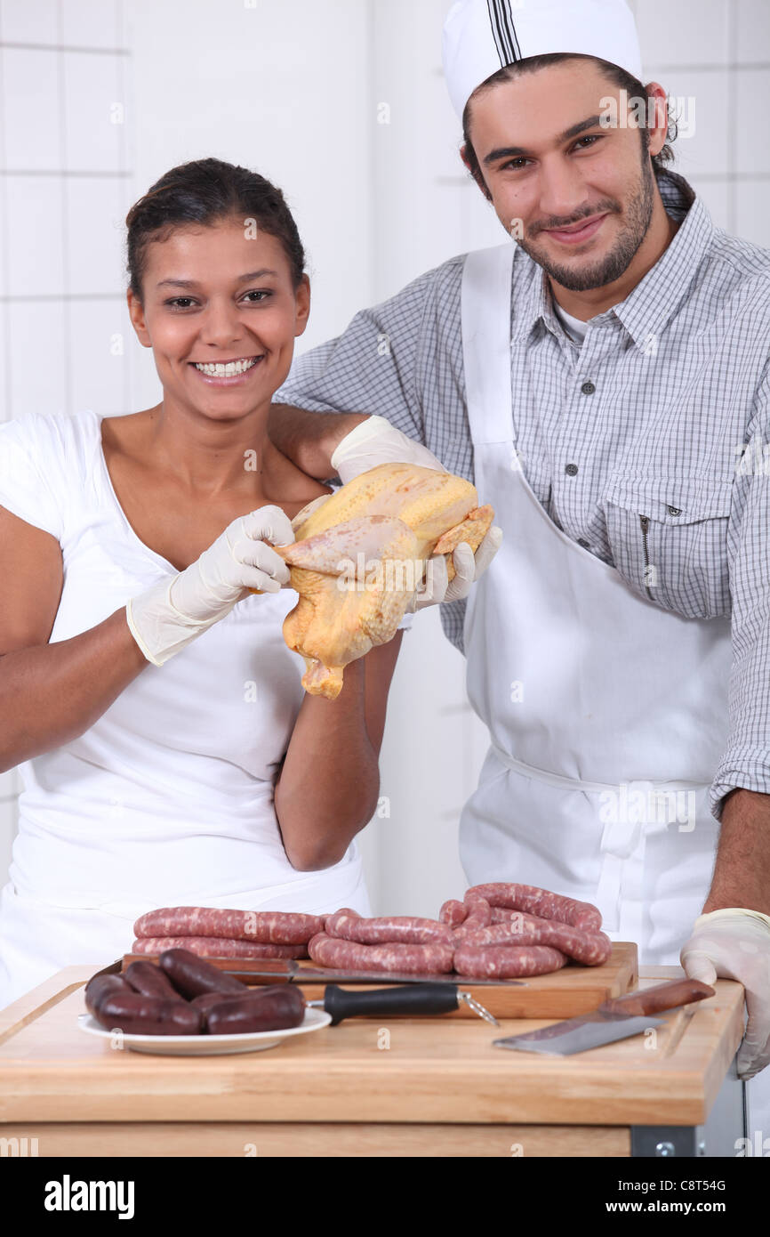 two butchers cutting fresh meat Stock Photo - Alamy