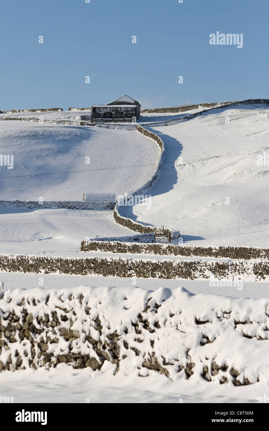 Farmers field with a barn covered in snow Stock Photo - Alamy
