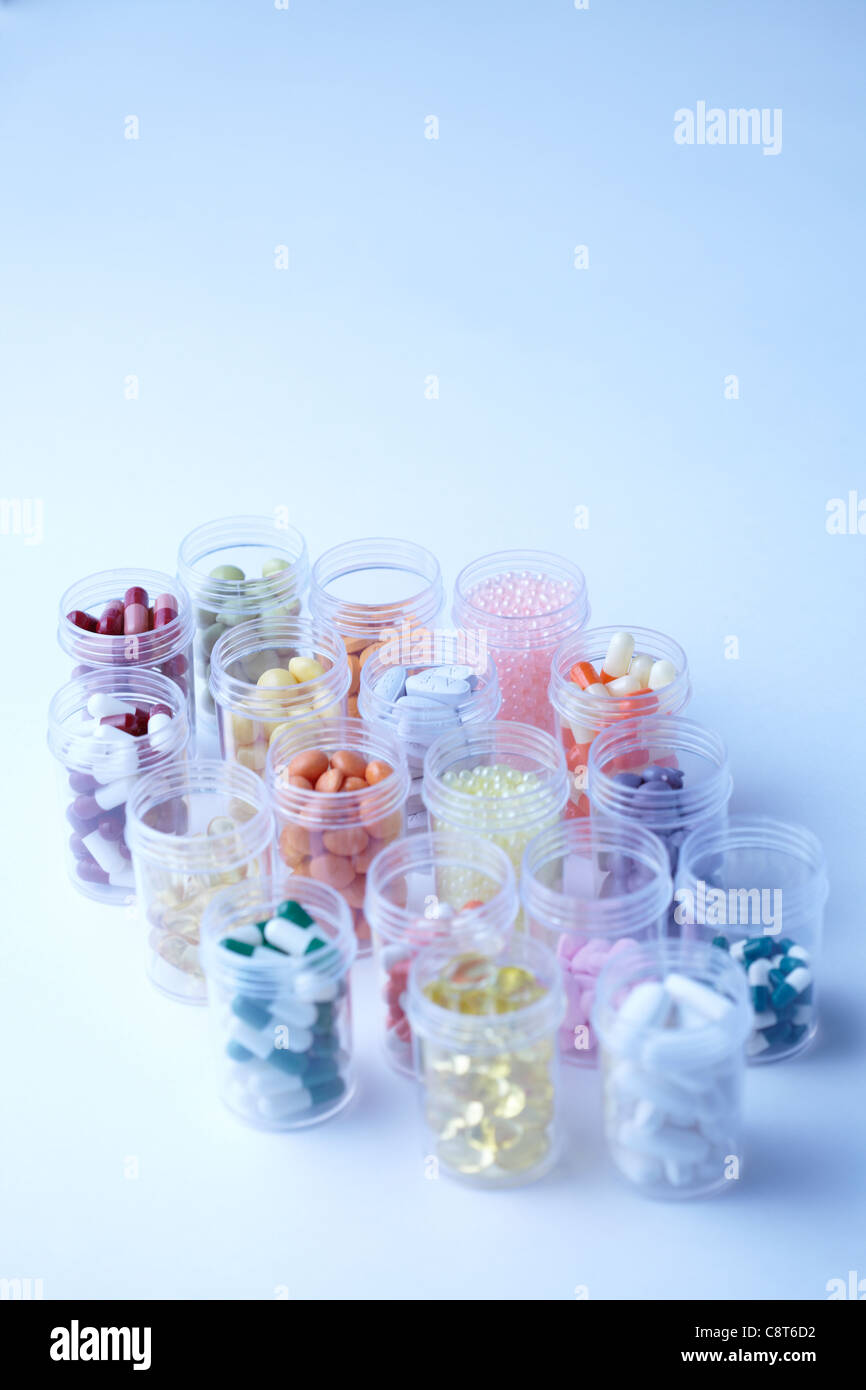 Plastic pill bottles filled with pills Stock Photo - Alamy