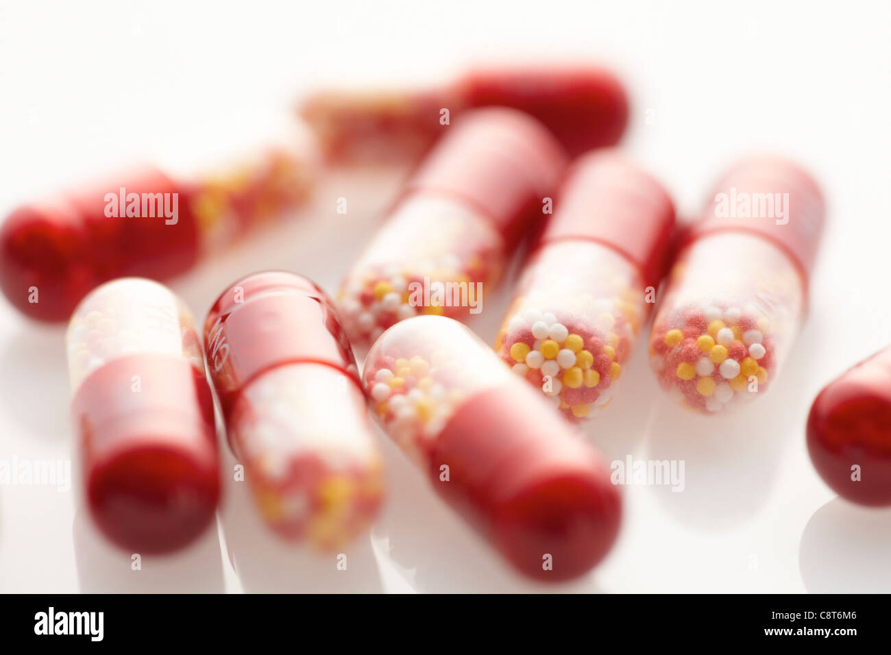 Close-up of pill capsules on white background Stock Photo - Alamy