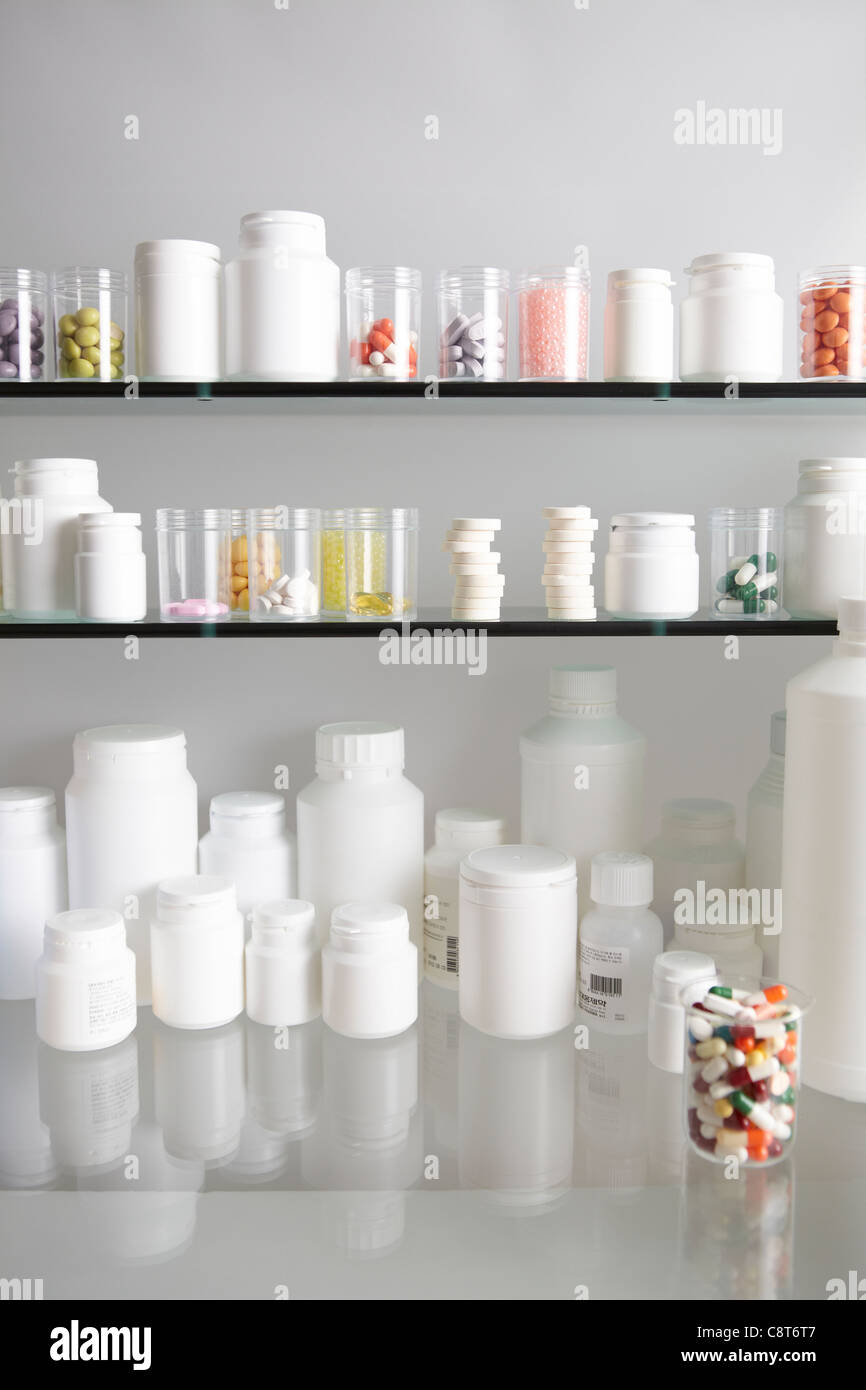 Medical shelf with pill containers Stock Photo - Alamy