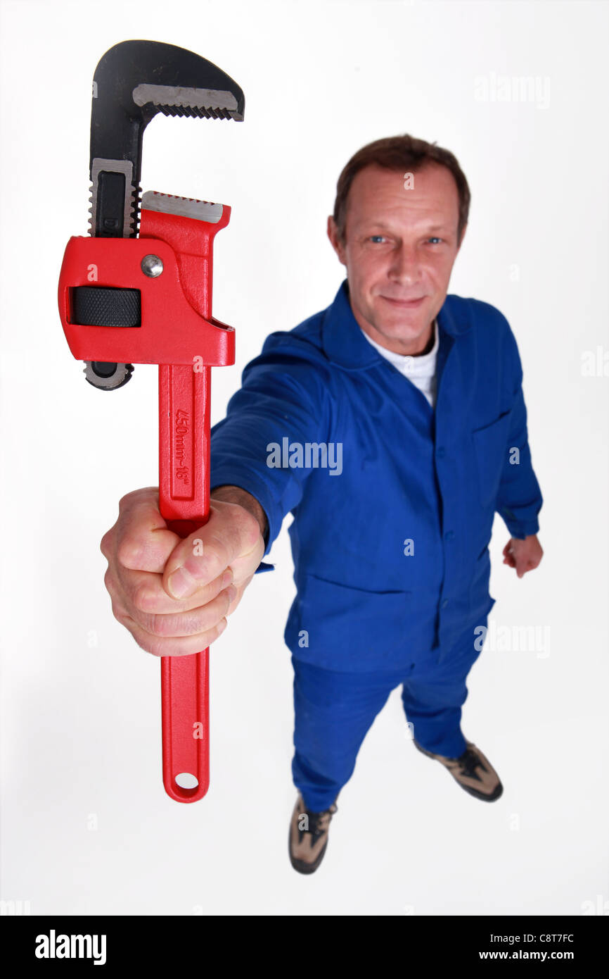Manual worker with wrench Stock Photo - Alamy