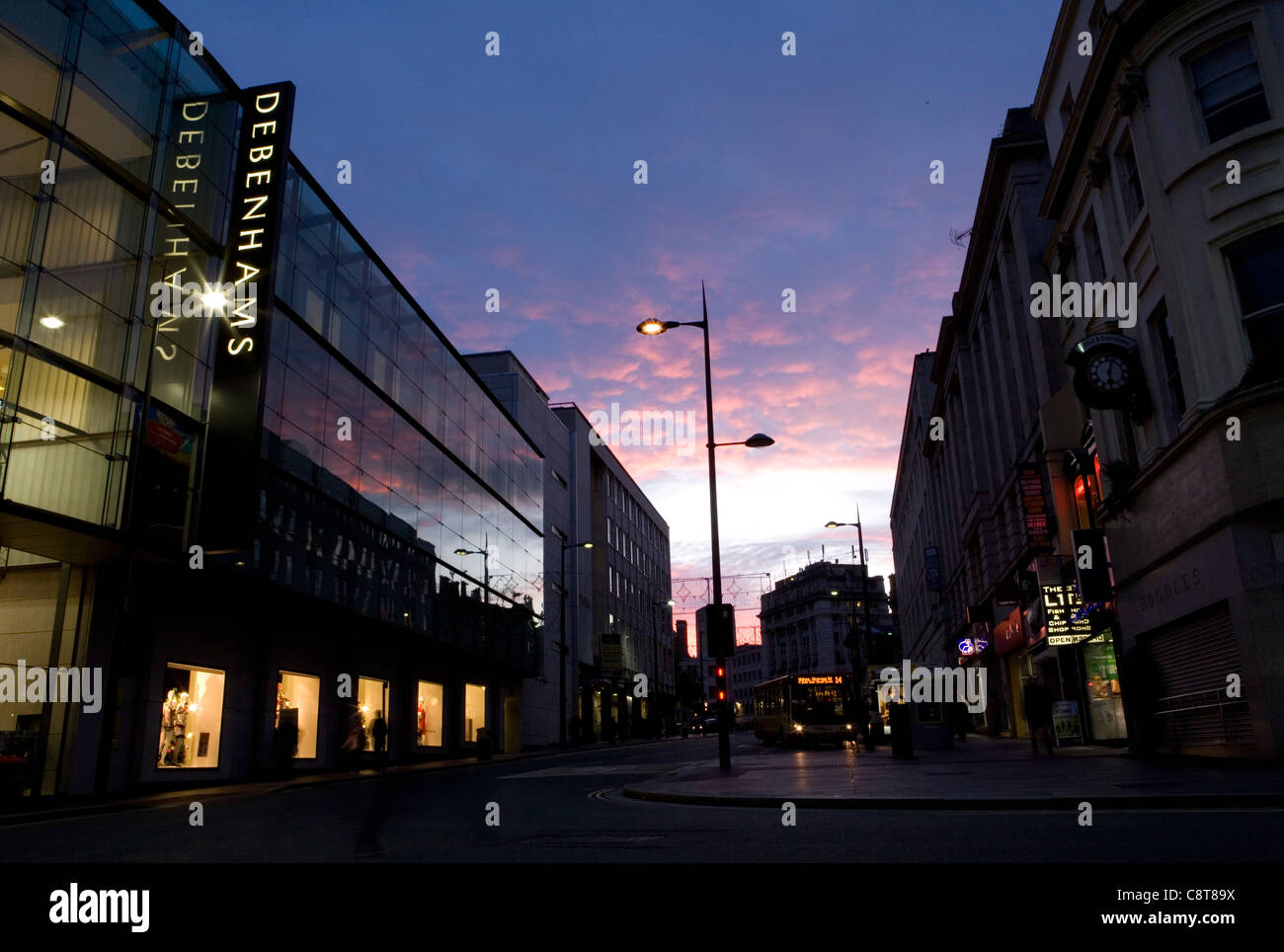 Manchester centre shops at dusk Stock Photo - Alamy