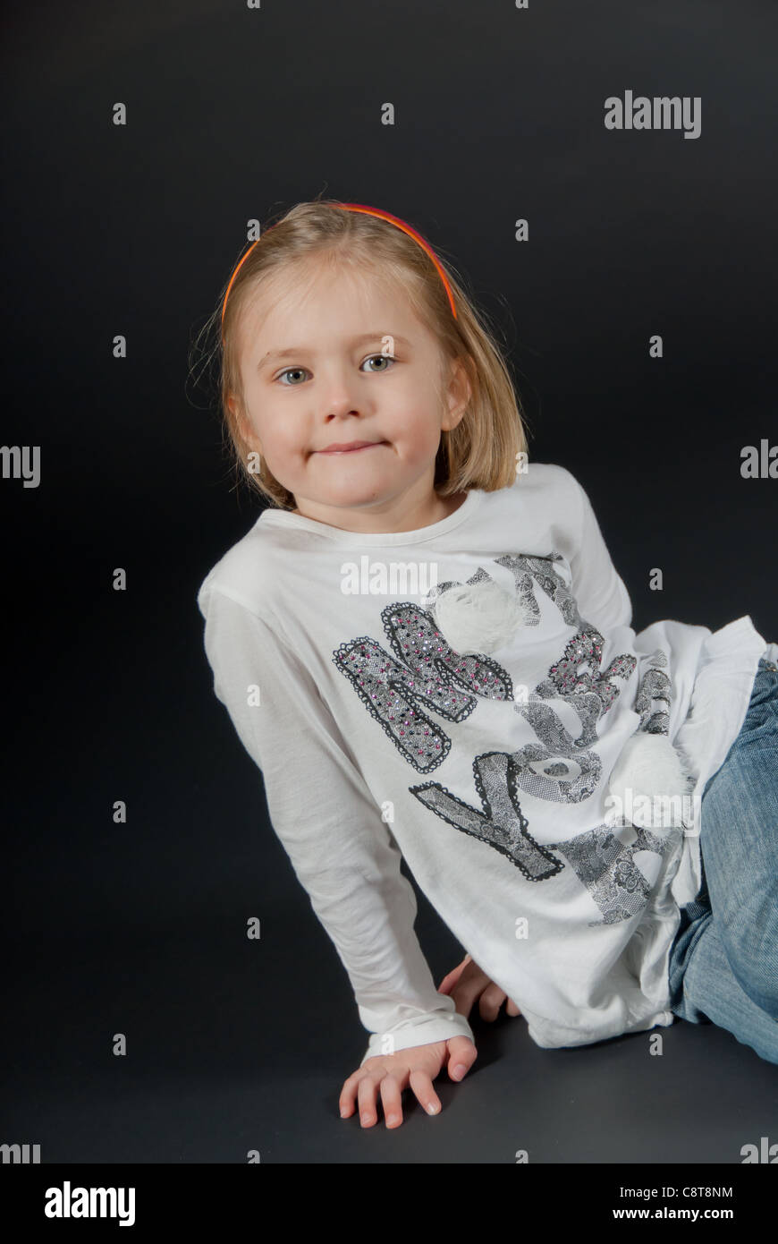 Cute girl - studio shoot with black background Stock Photo - Alamy