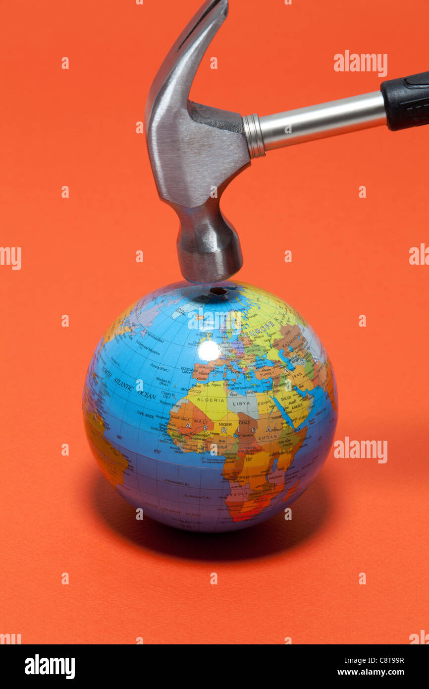 Globe And Hammer With Orange Background Stock Photo - Alamy