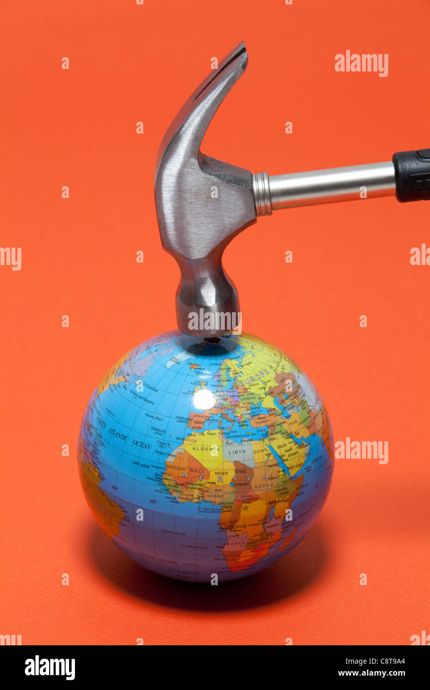 Globe And Hammer With Orange Background Stock Photo - Alamy