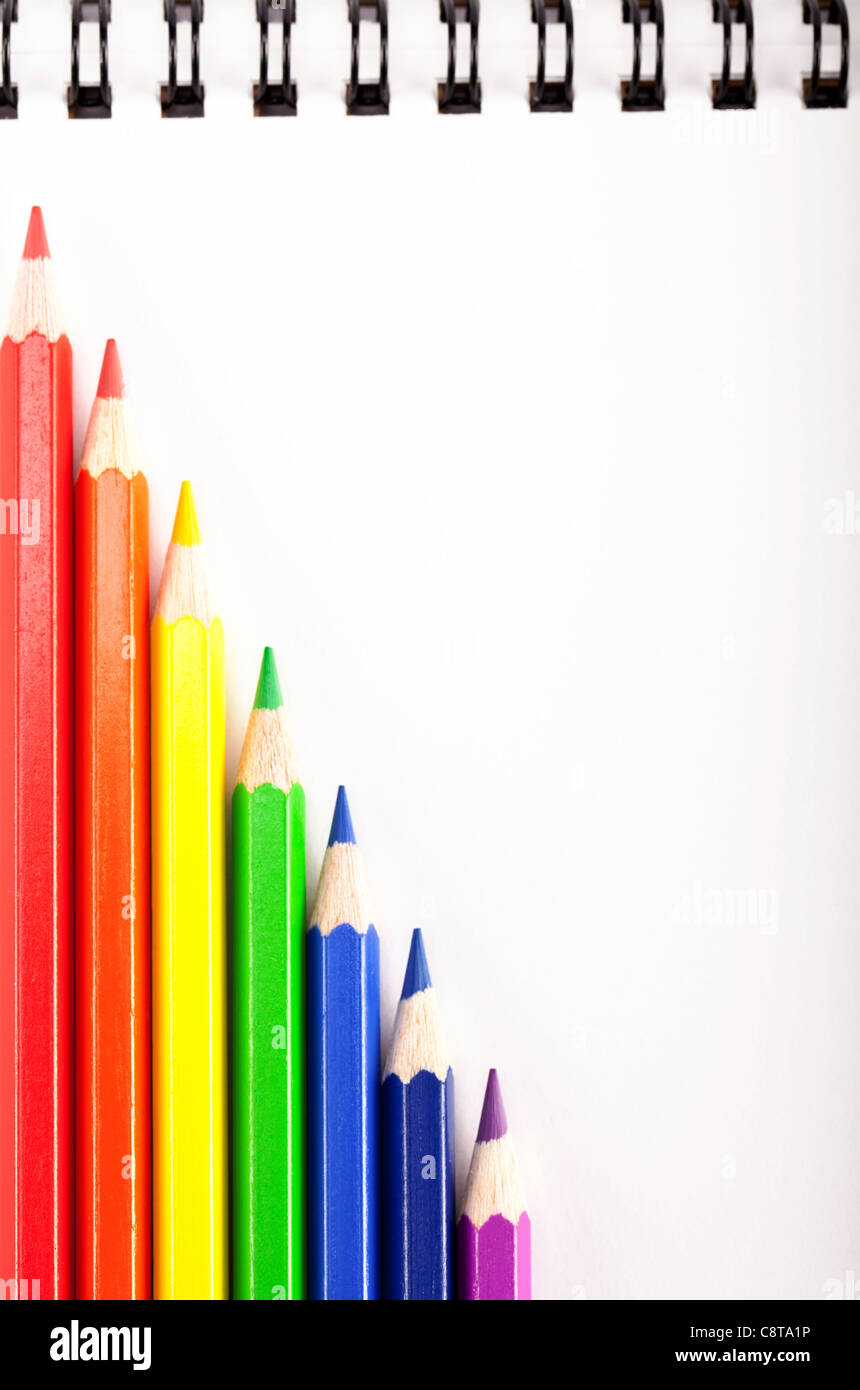 Multi Colored Pencil On A Pad Stock Photo - Alamy