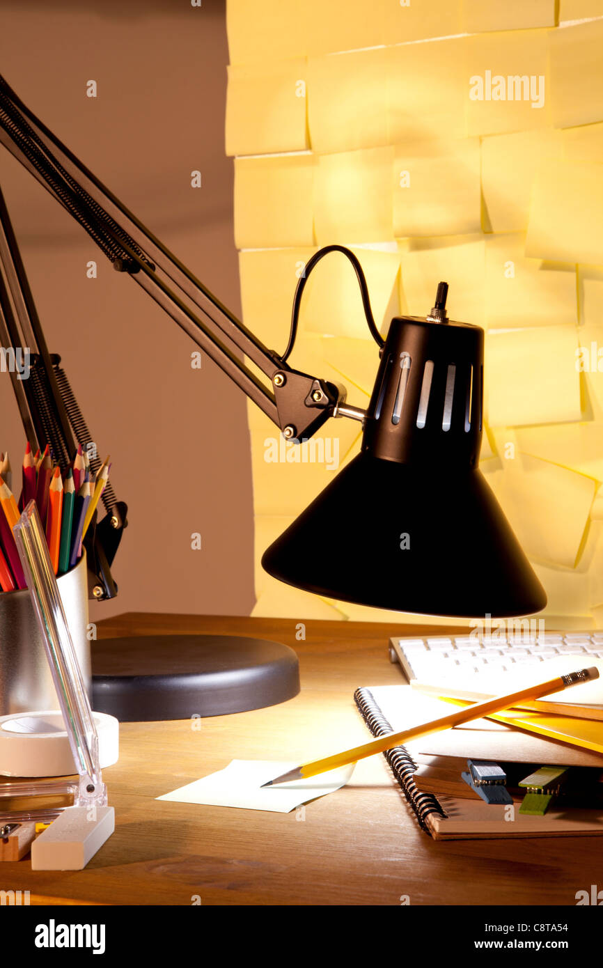 Pencil And Computer Keyboard Under Lamp Stock Photo - Alamy