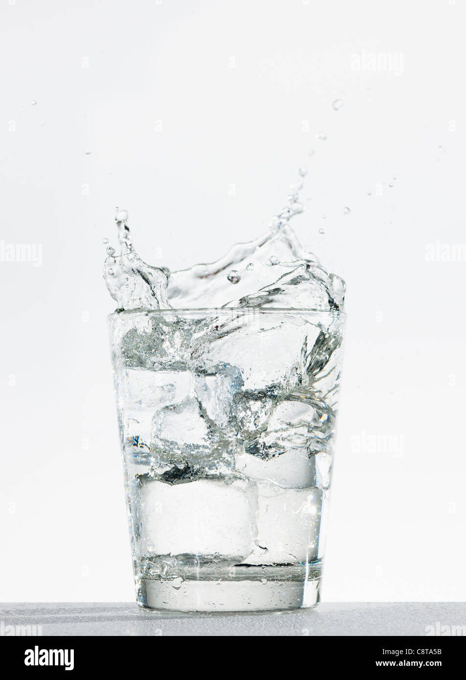 Studio shot of glass of water with splash Stock Photo - Alamy