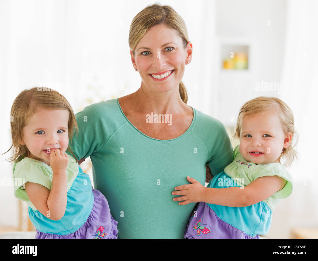 Holding 2 children mother usa hi-res stock photography and images - Alamy