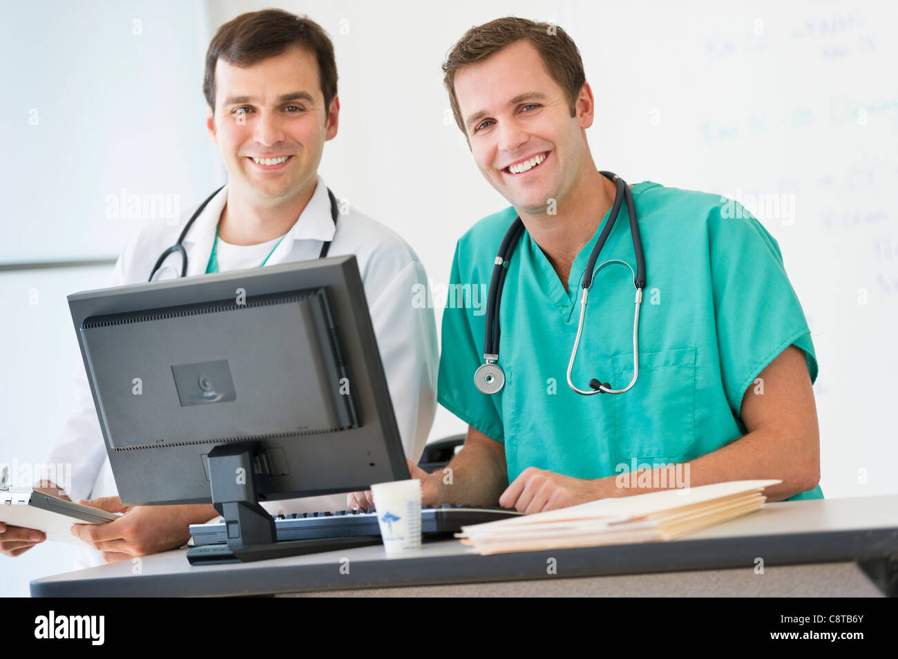 USA, New Jersey, Jersey City, Portrait of two doctors using computer ...