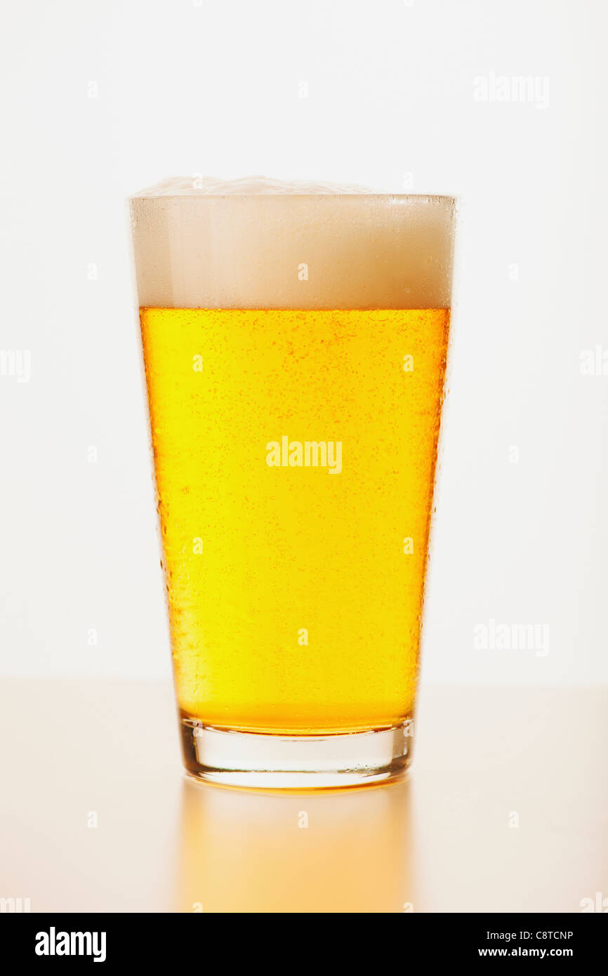 Studio shot of pale ale in glass Stock Photo - Alamy