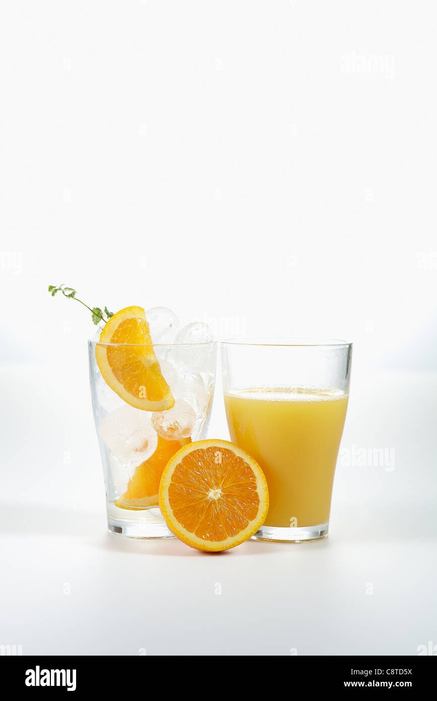Juice In A Glass With Slice Of Fruit Stock Photo - Alamy