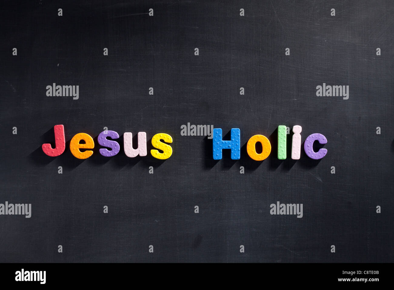 Jesus Holic' in multi colored alphabets Stock Photo - Alamy
