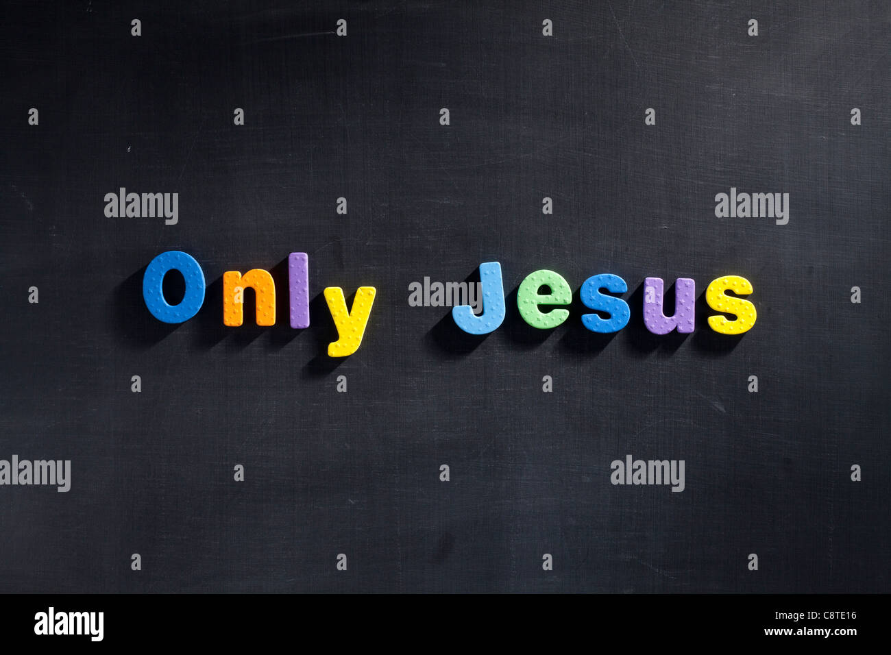Only Jesus' in multi colored alphabets Stock Photo - Alamy