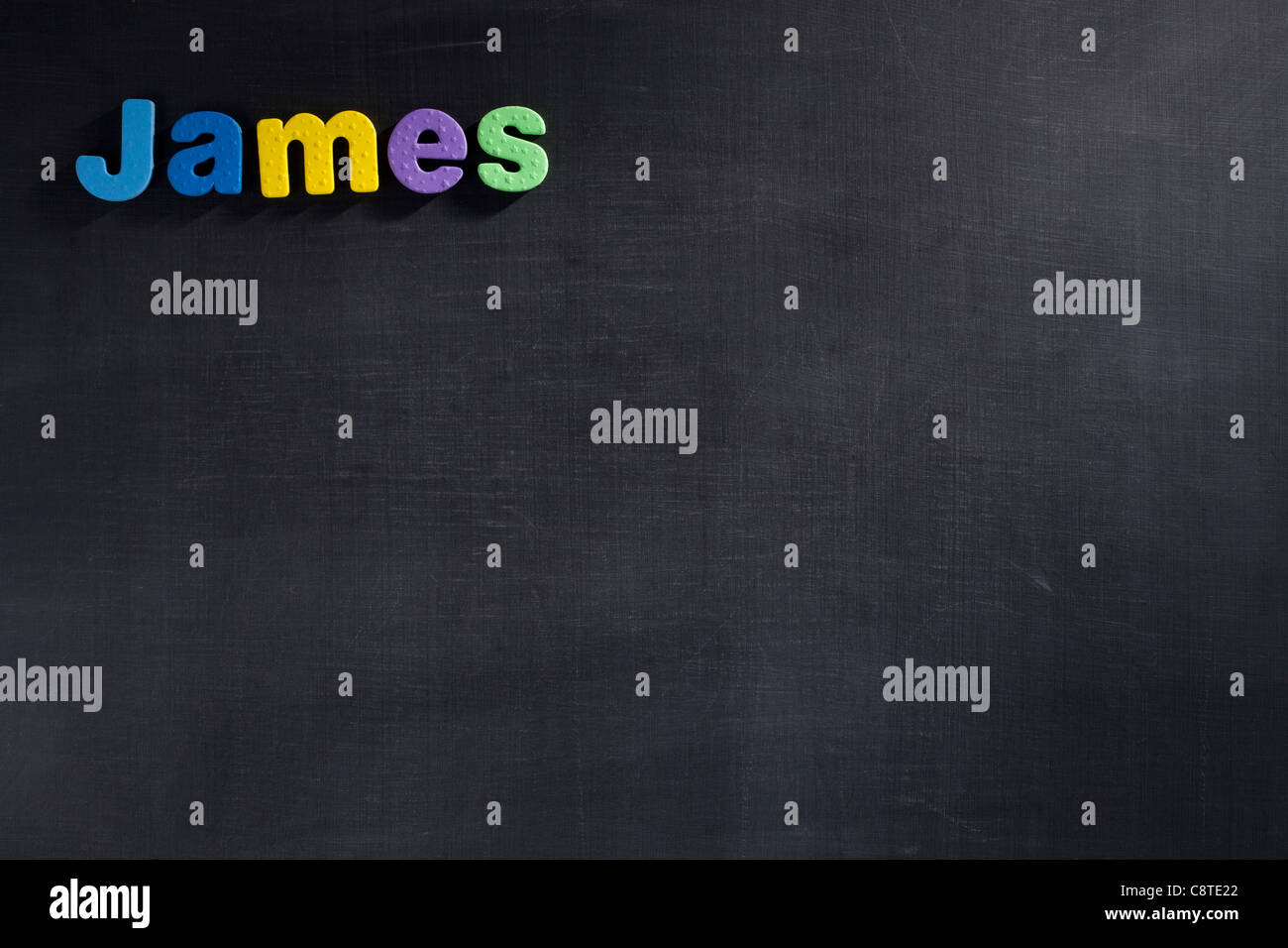 Letters spelling out 'James' on black background Stock Photo - Alamy