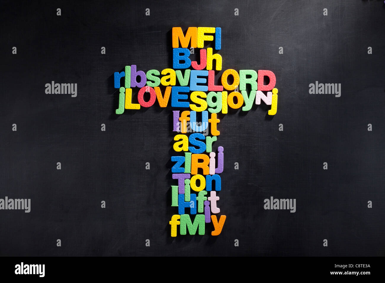 Colorful alphabets arranged in a cross shape Stock Photo - Alamy