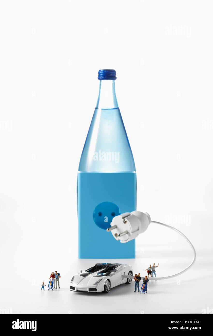 Electric toy car in front of bottle socket on white background Stock ...