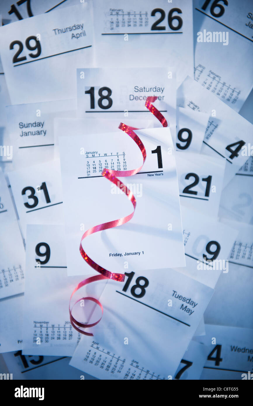 Calendar cards and red ribbon Stock Photo - Alamy