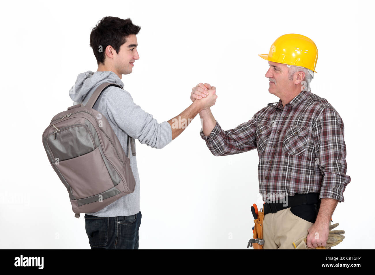 craftsman and apprentice shaking hands Stock Photo - Alamy