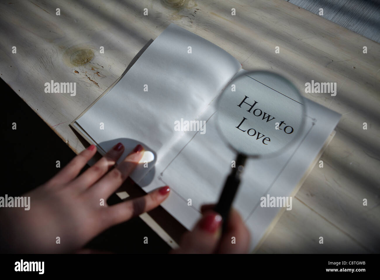 Small book magnifying glass hi-res stock photography and images - Alamy