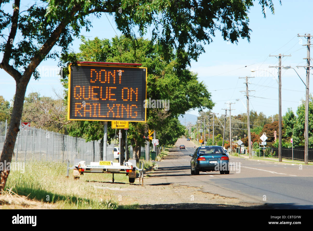 Mobile traffic sign "Don't queue on rail crossing Stock Photo - Alamy