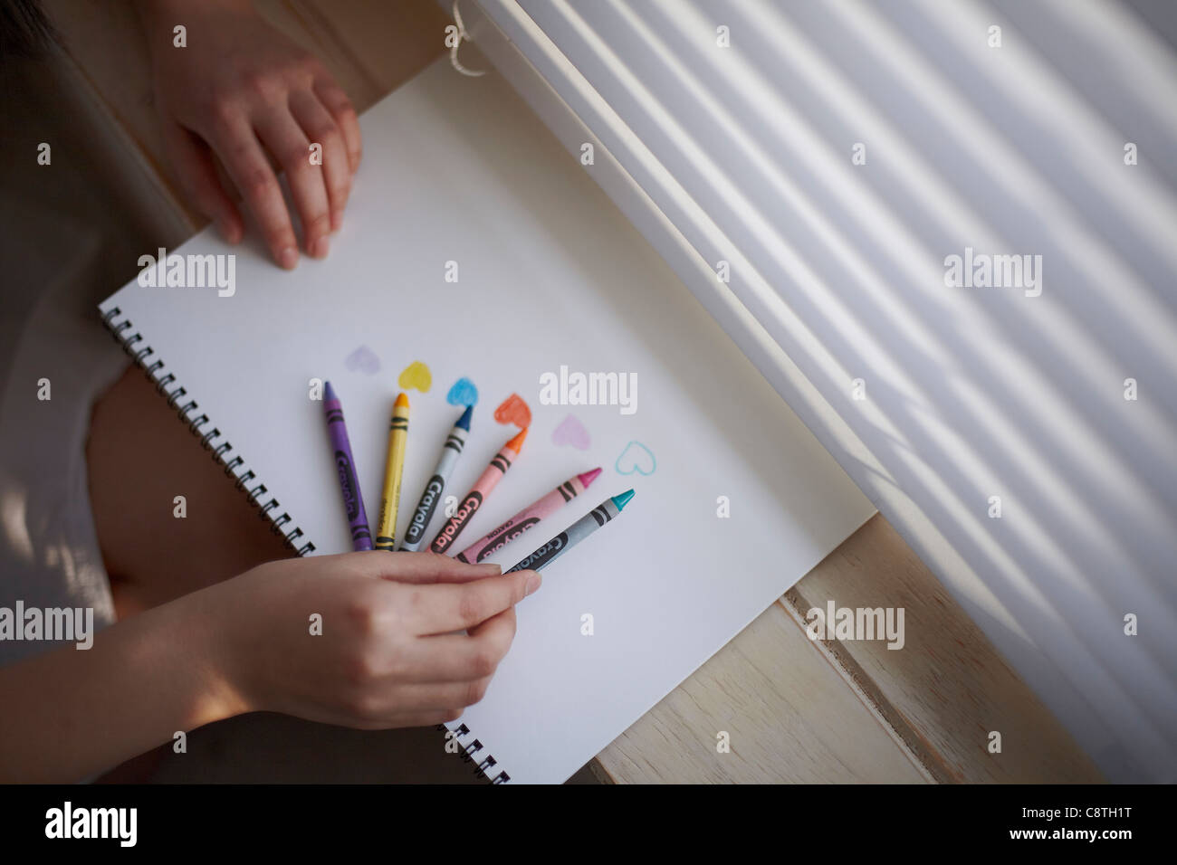 Woman With Crayons And Paper Stock Photo - Alamy
