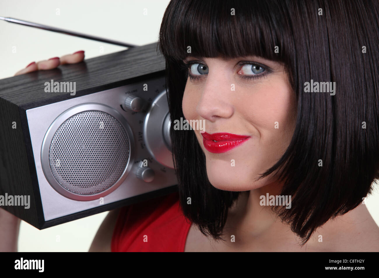 Gorgeous woman with a radio on her shoulder Stock Photo - Alamy