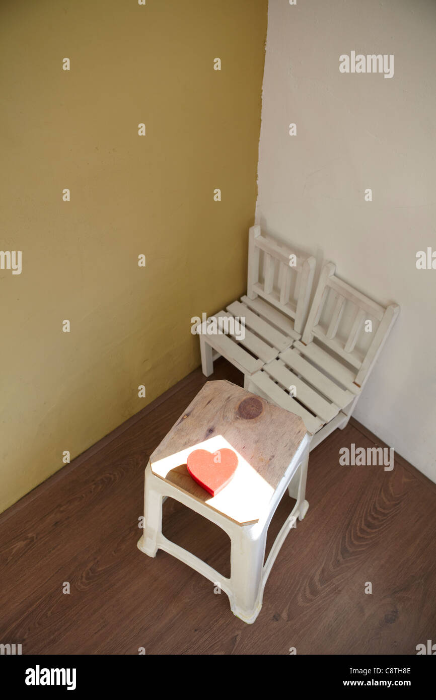 Heart On A Stool With Chair Stock Photo - Alamy