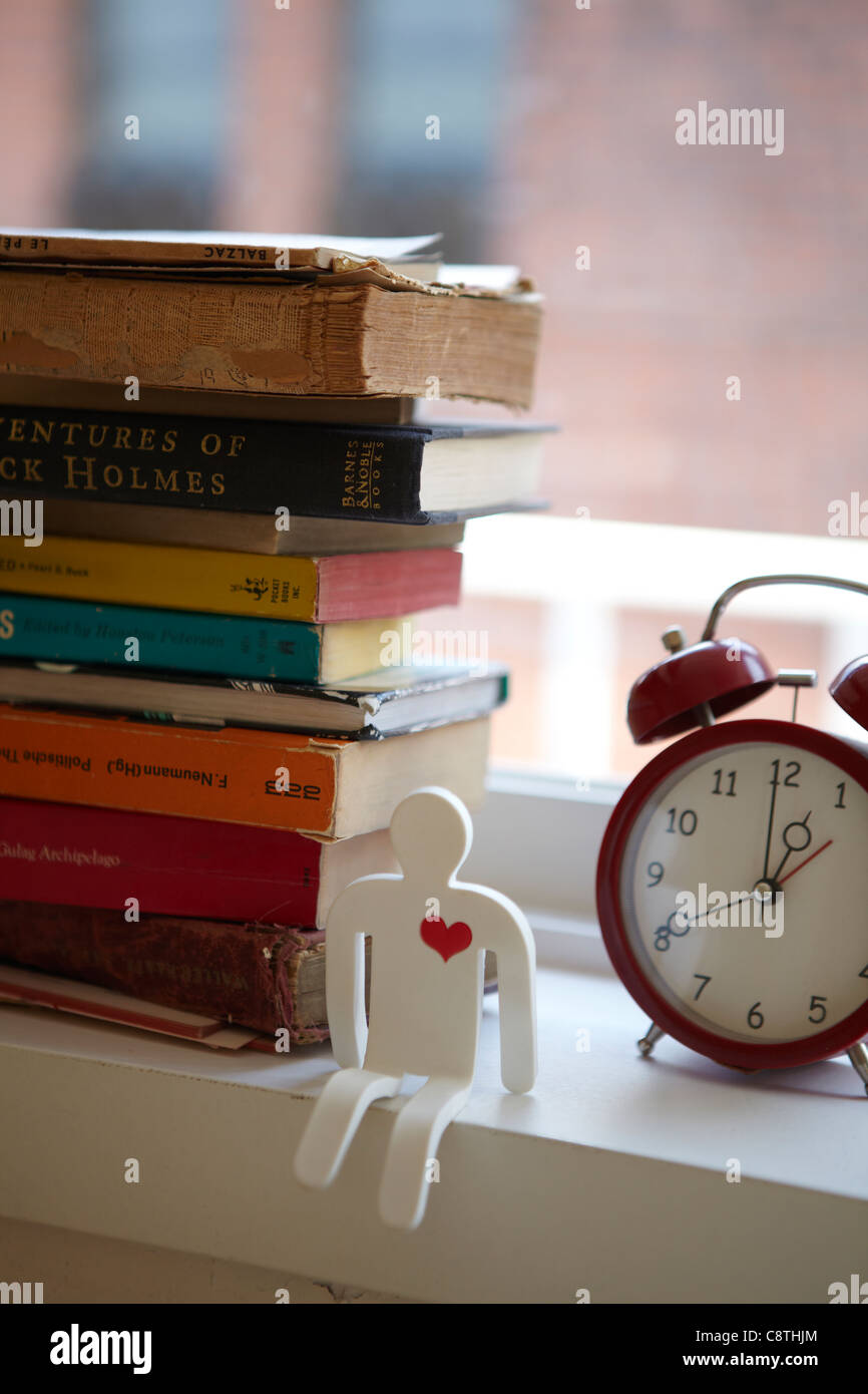 Human Representation With Books And Clock Stock Photo - Alamy