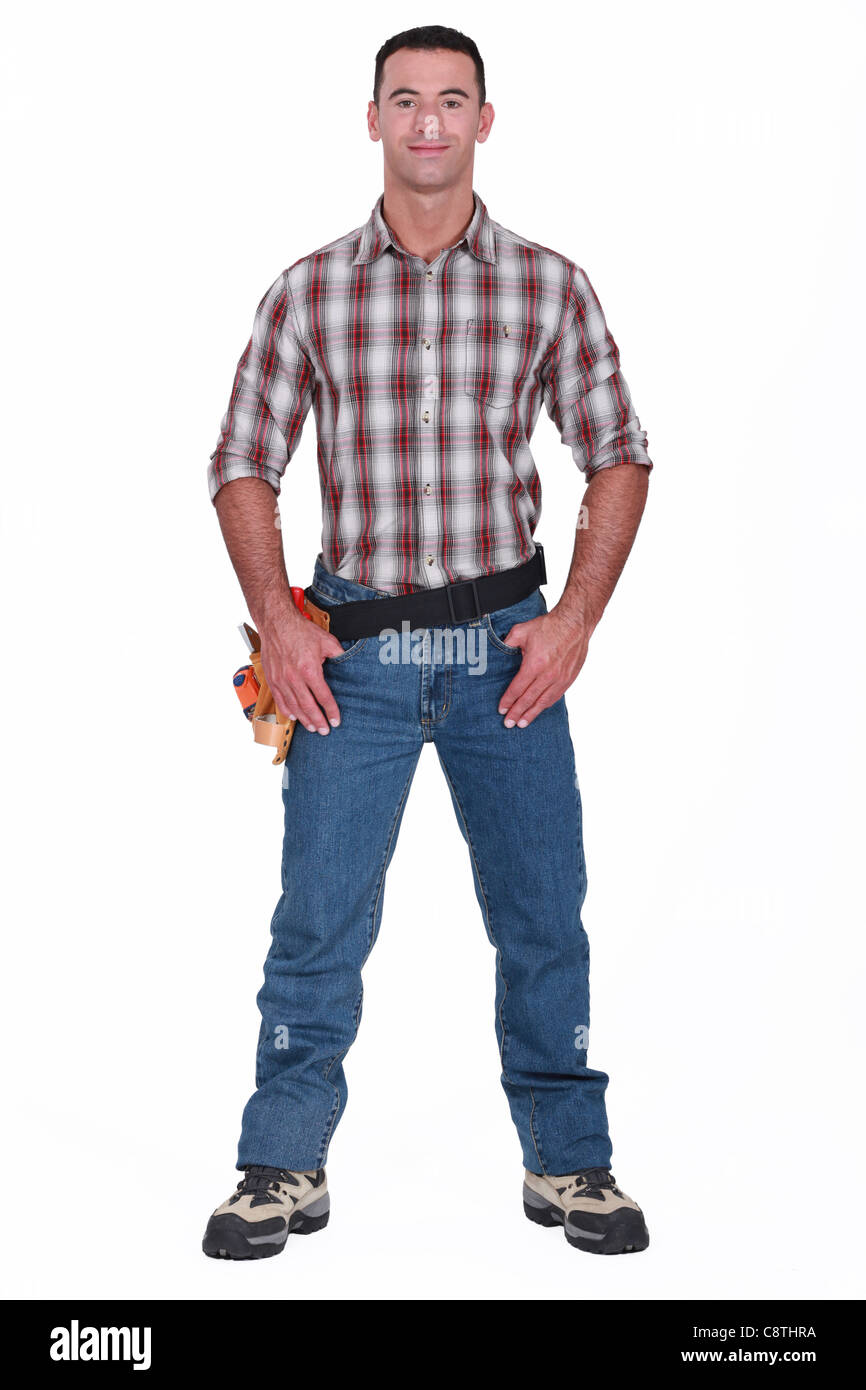 Builder stood in studio Stock Photo - Alamy