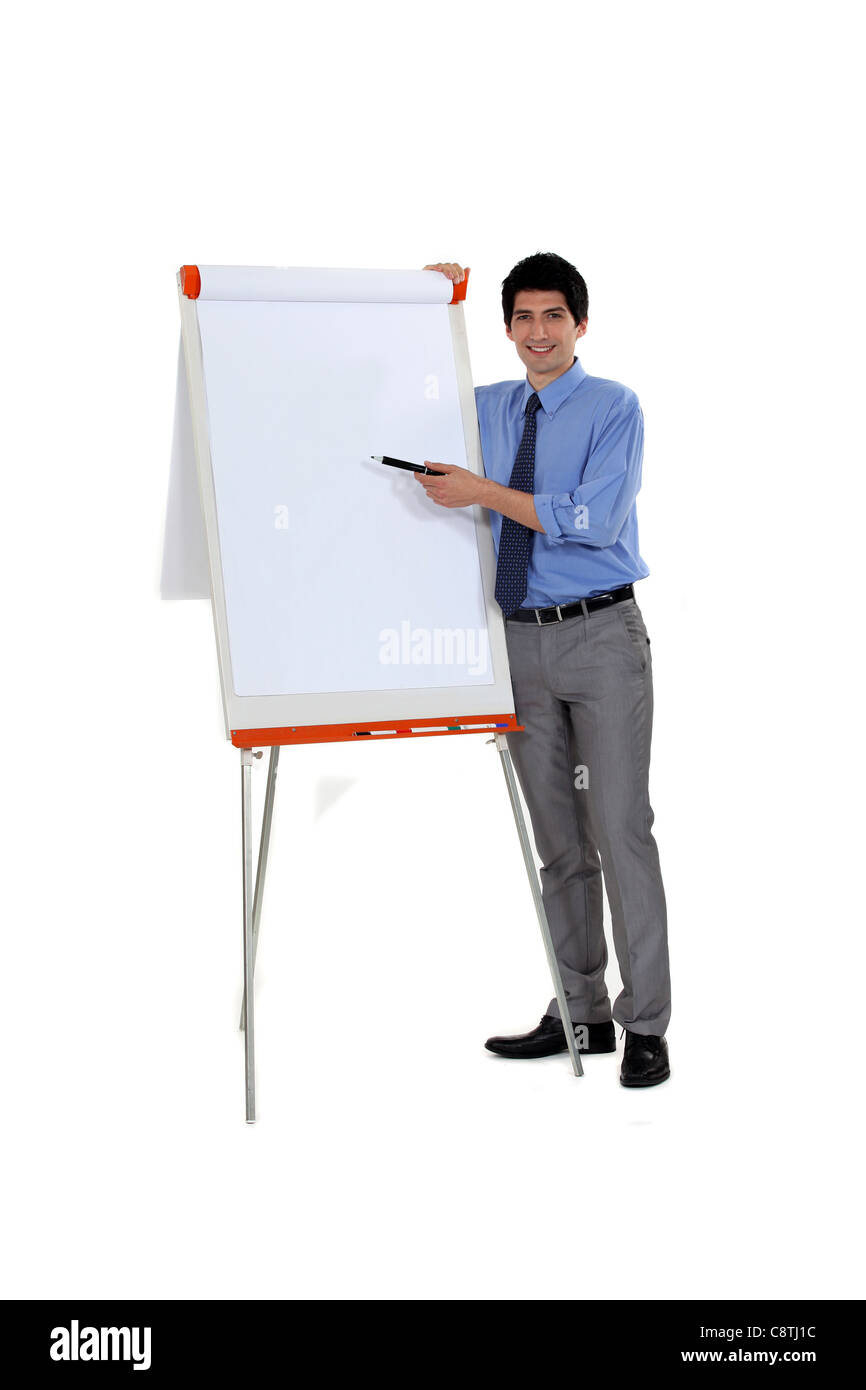 Man pointing at flip chart with pen Stock Photo - Alamy