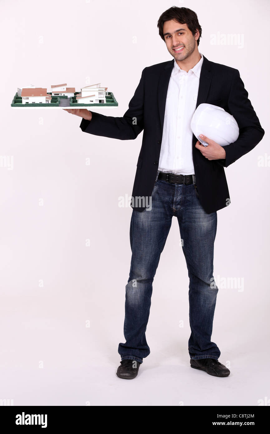 portrait of attractive architect with model Stock Photo - Alamy