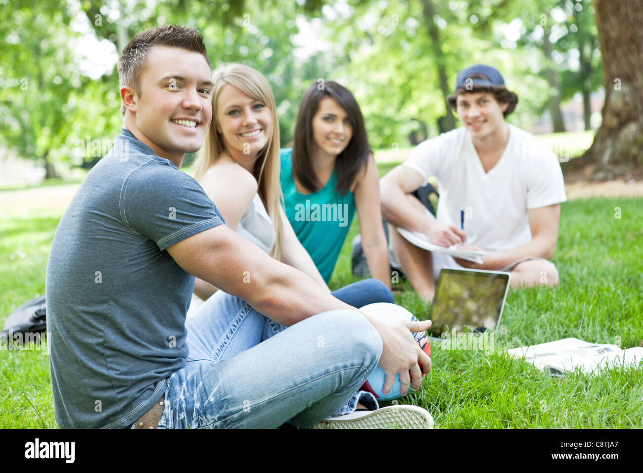 USA, Washington, Seattle, Portrait of college students relaxing on ...
