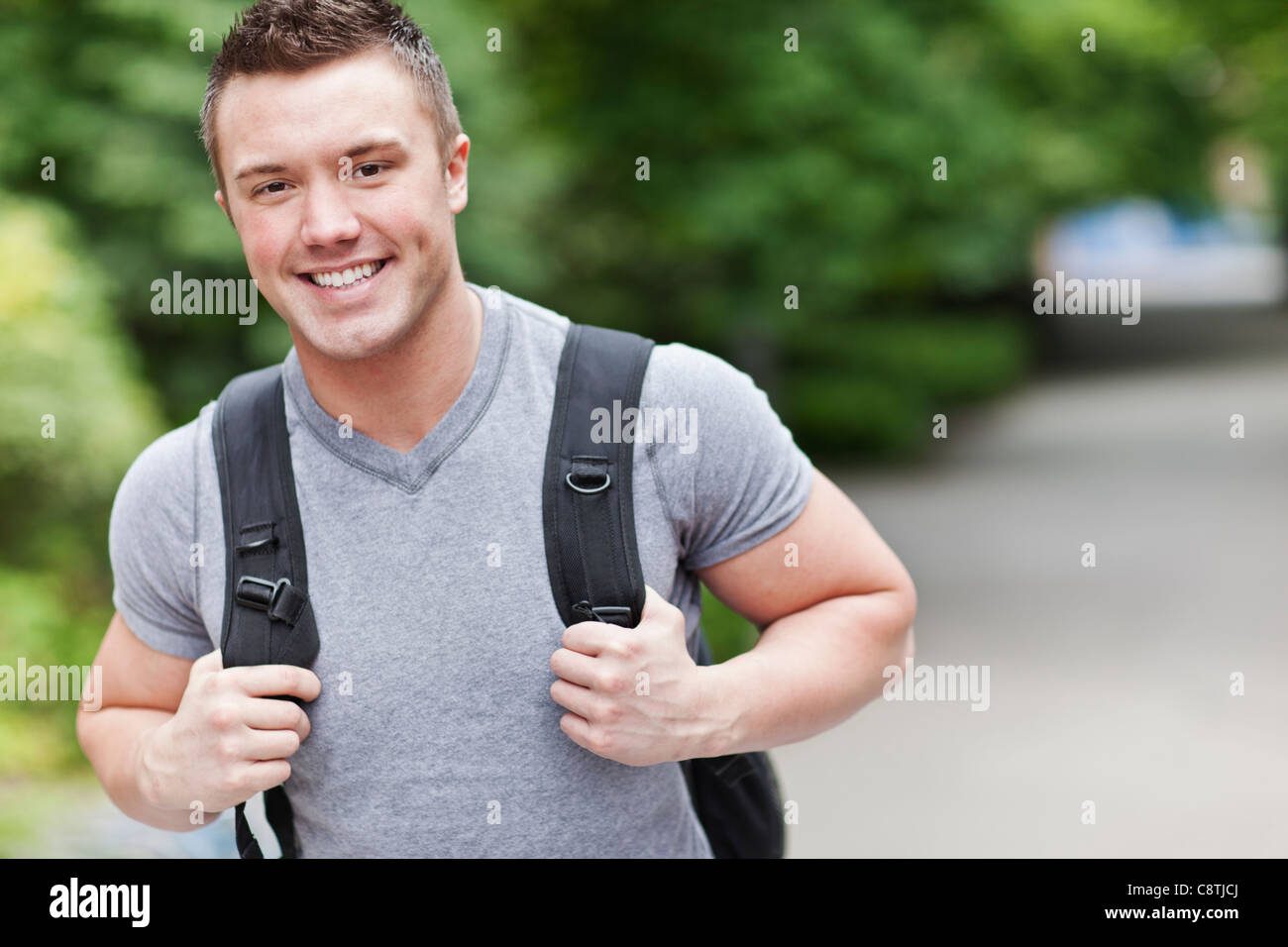 USA, Washington, Seattle, Portrait of male college student smiling ...