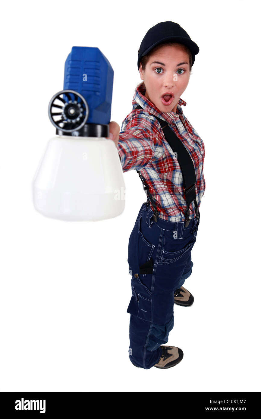 Woman holding spray painting hi-res stock photography and images - Alamy