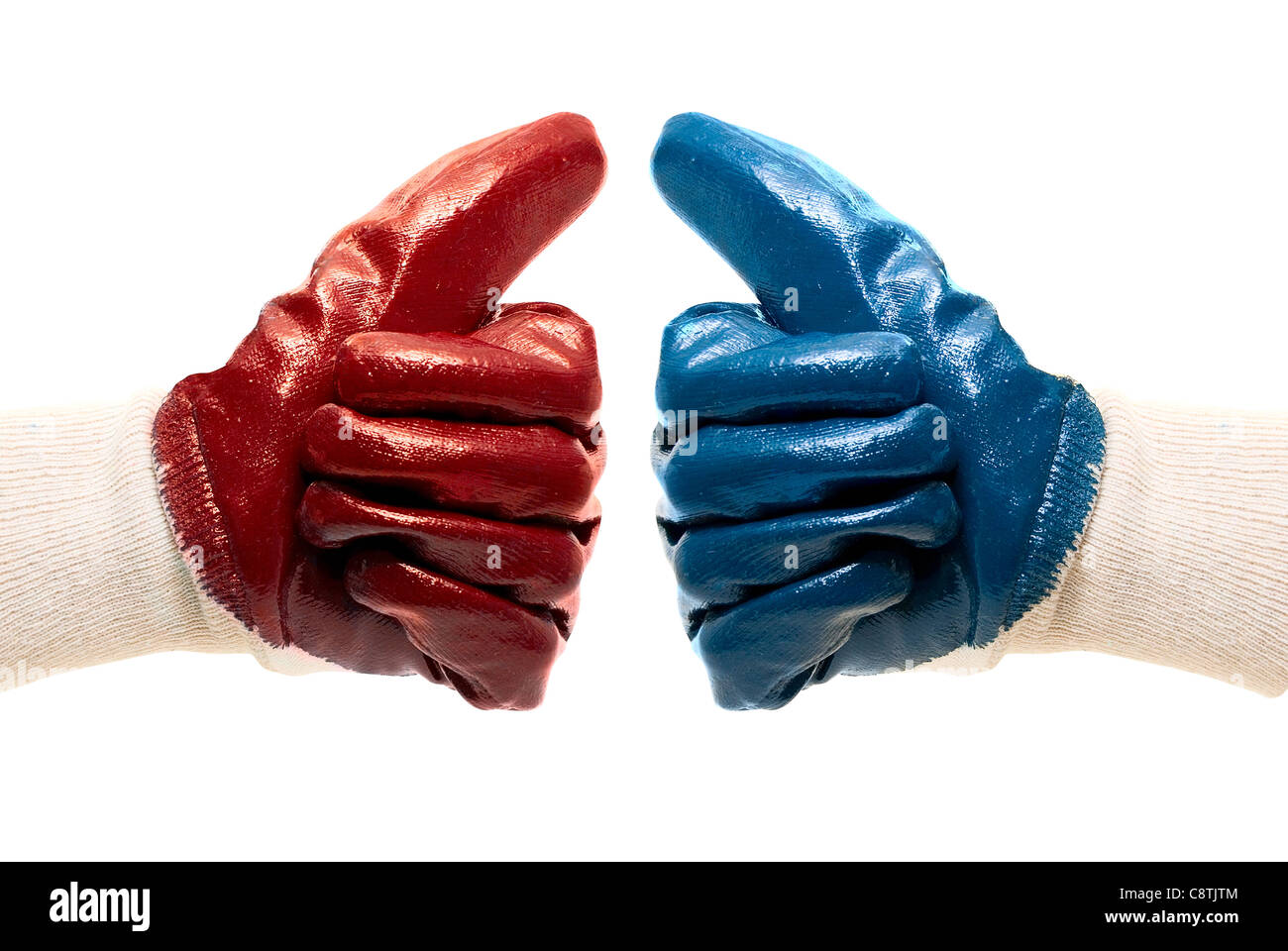 Two different color gloves gesturing a thumbs up sign Stock Photo - Alamy